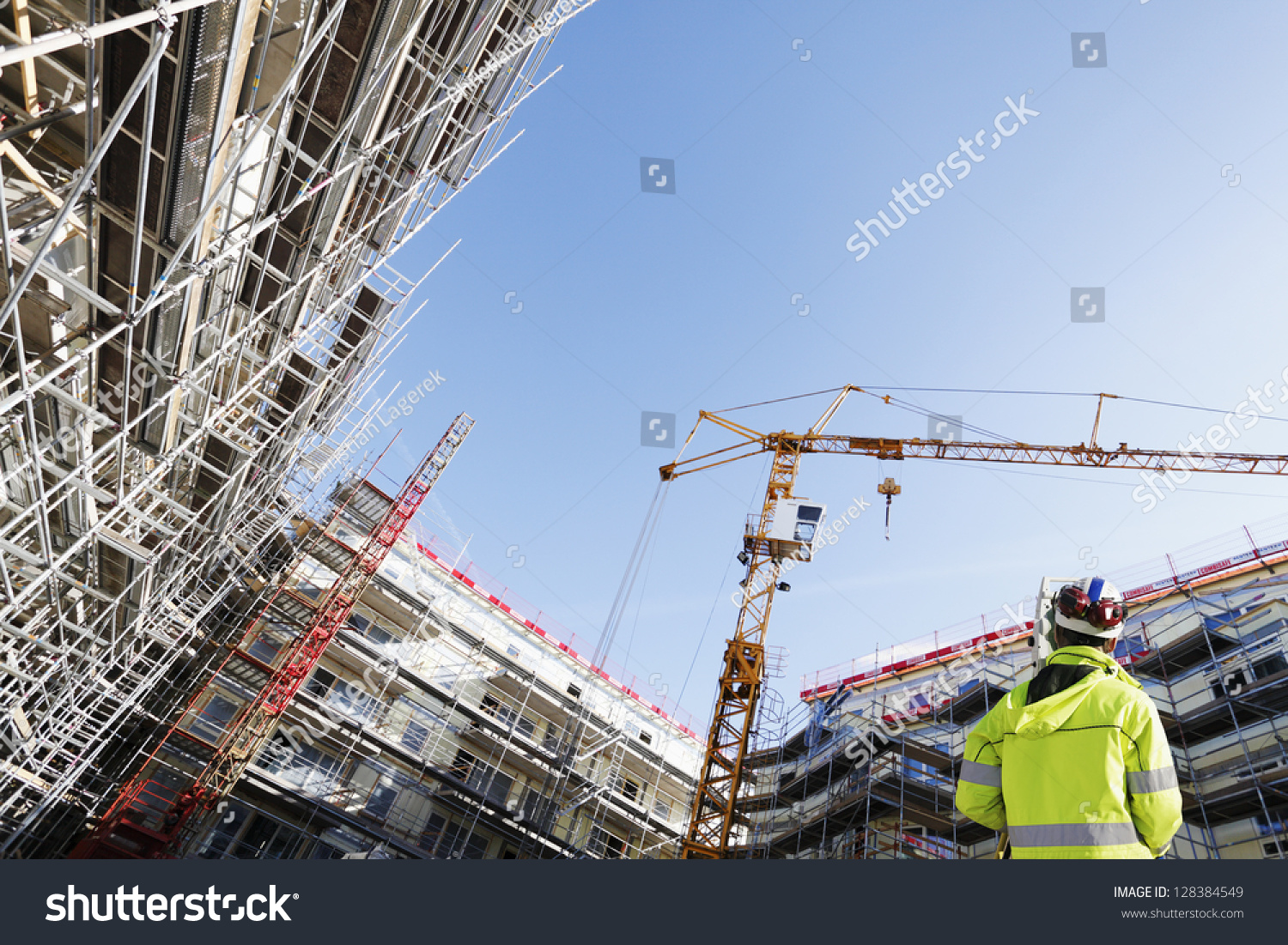 stock-photo-surveyor-with-instrument-surveying-large-building-site-super-wide-perspective ...
